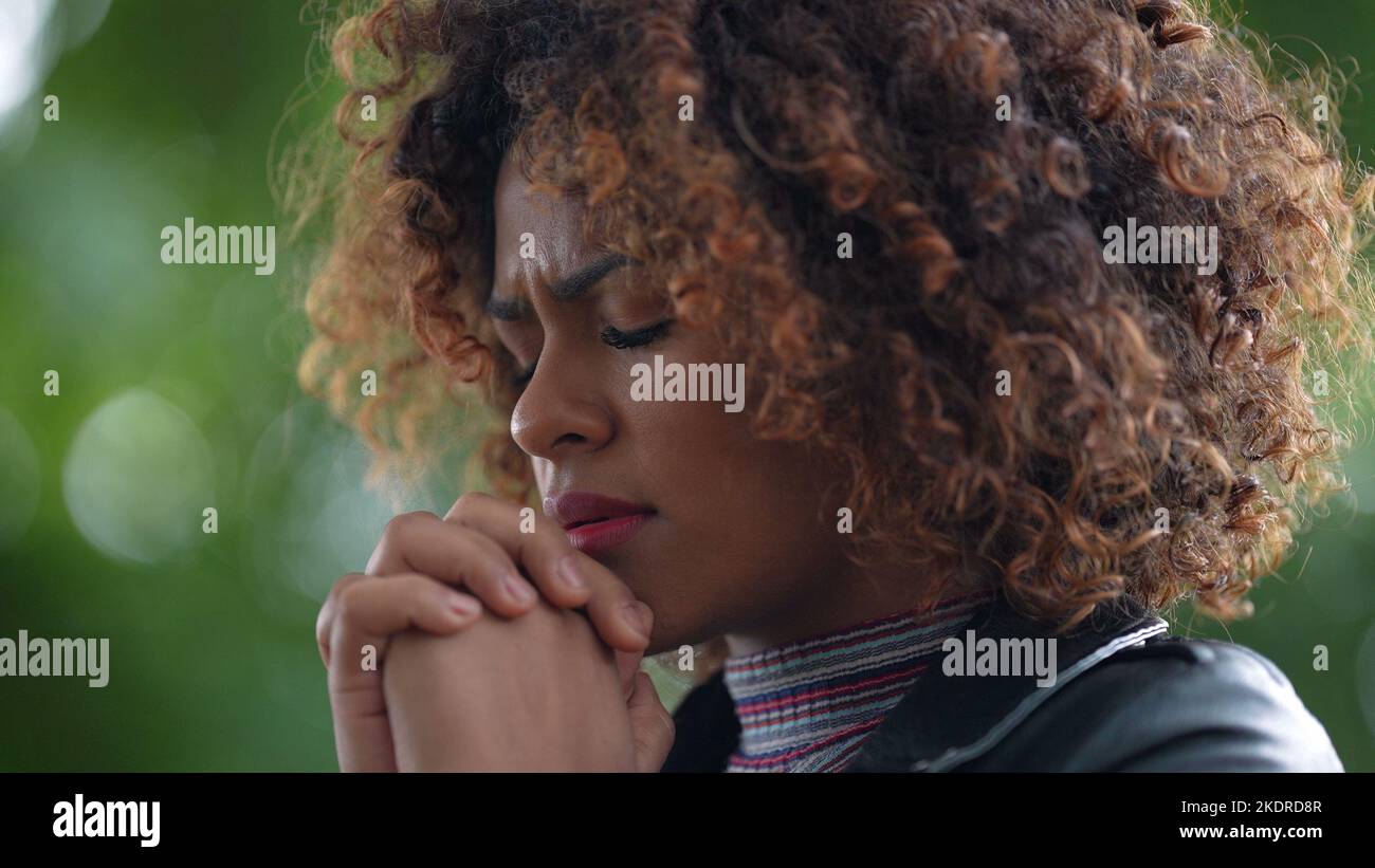 Brazilian woman praying to God. Spiritual person prays having faith ...