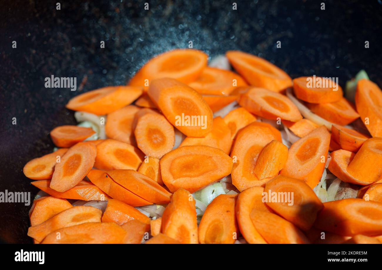 Carrot is cooked in cauldron on fire. Step by step cooking of Chorba ...