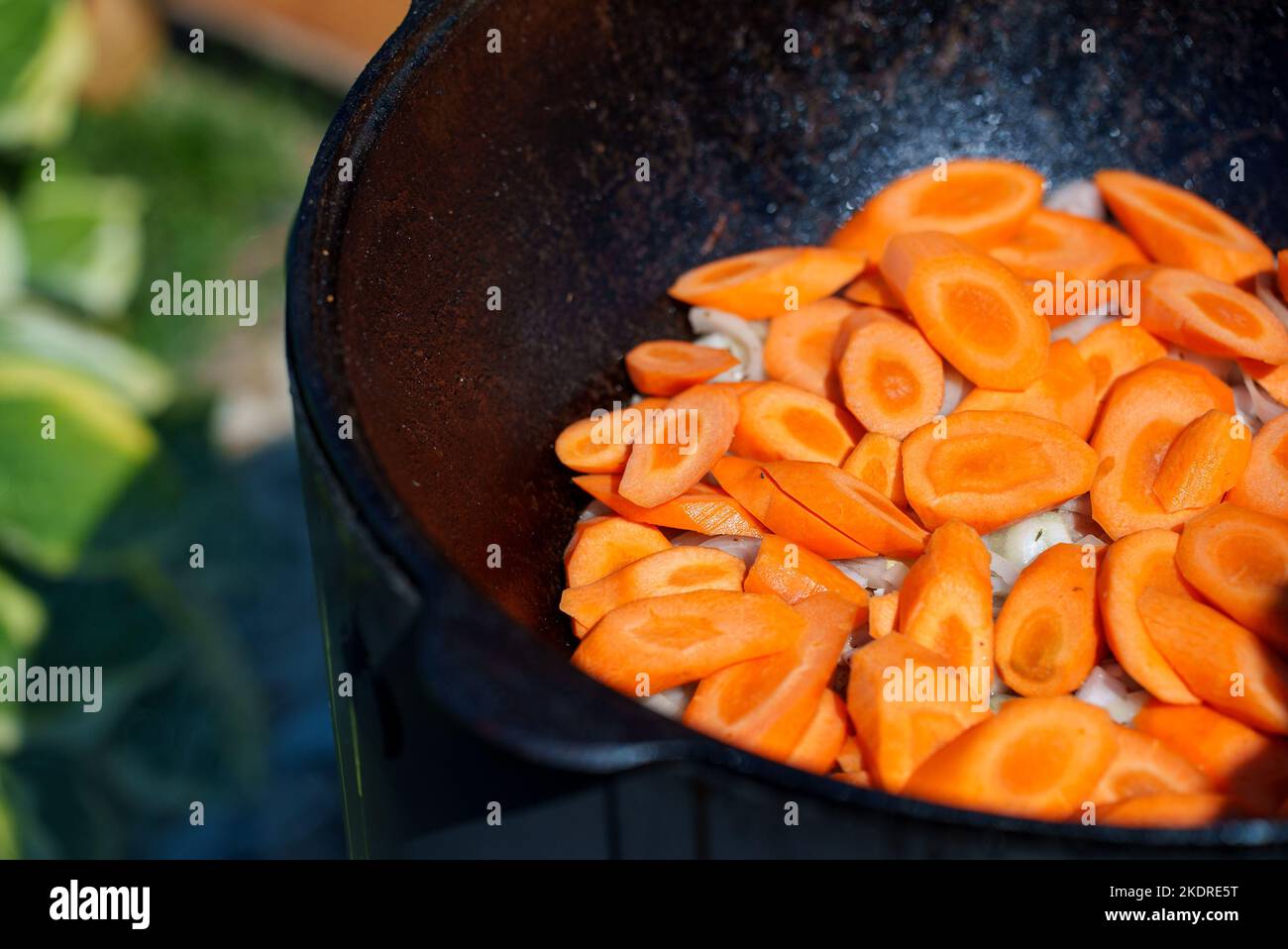Carrot is cooked in cauldron on fire. Step by step cooking of Chorba ...