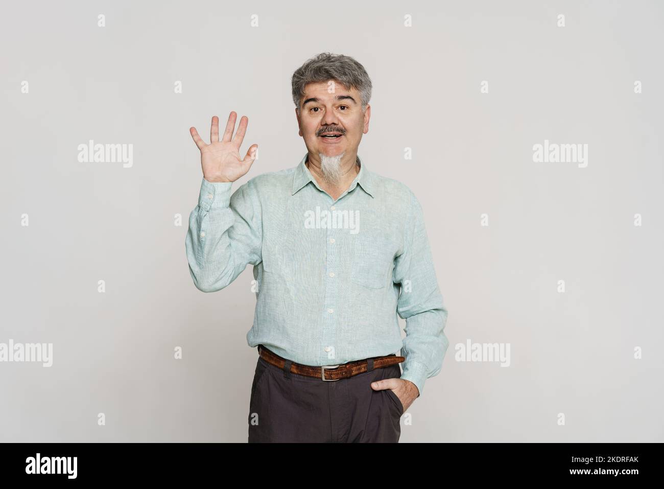 Portrait man looking waving camera hi-res stock photography and images ...