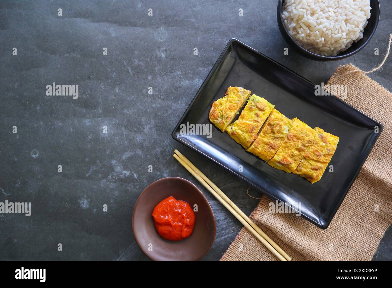 Telur dadar gulung or Tamagoyaki or Japaneses egg roll. Gyeran Mari or ...