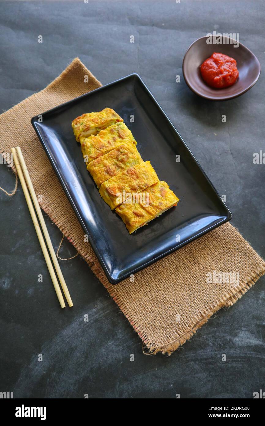 Telur dadar gulung or Tamagoyaki or Japaneses egg roll. Gyeran Mari or ...