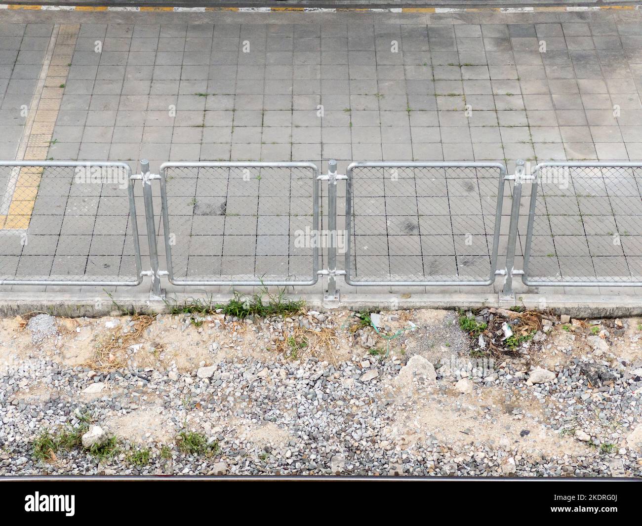 The metal fence along the railway and pavement to protect pedestrians ...