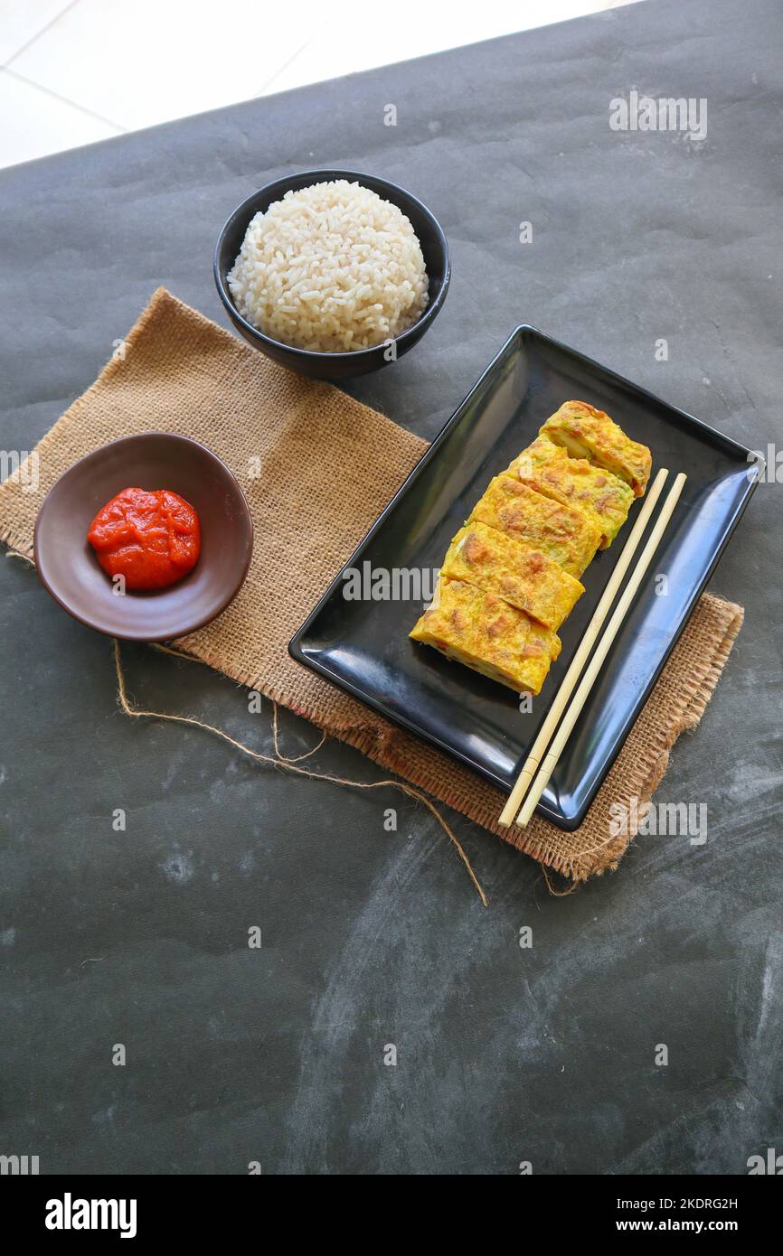 Telur dadar gulung or Tamagoyaki or Japaneses egg roll. Gyeran Mari or ...