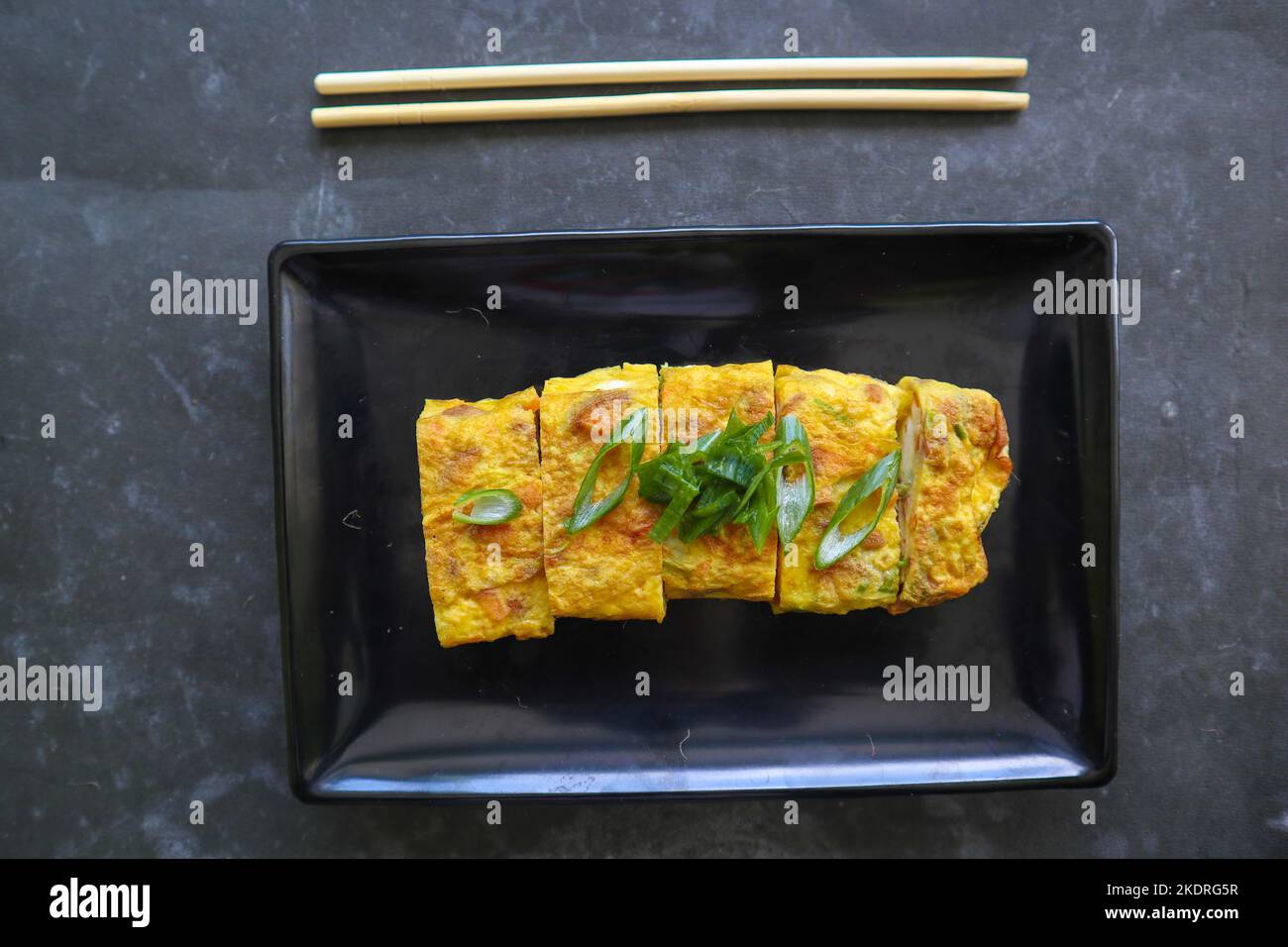 Telur dadar gulung or Tamagoyaki or Japaneses egg roll. Gyeran Mari or ...