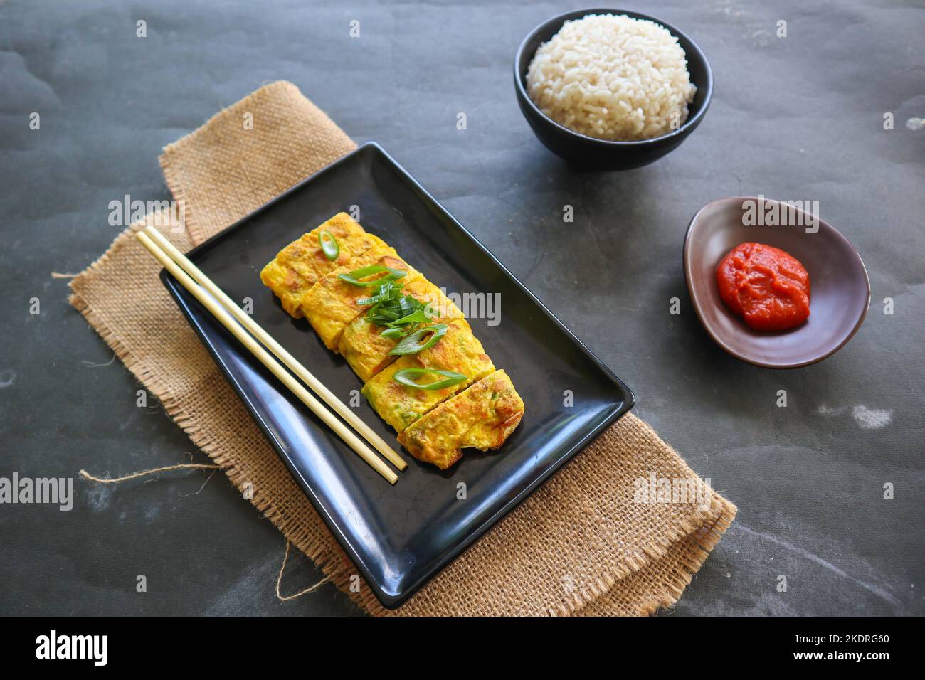 Telur dadar gulung or Tamagoyaki or Japaneses egg roll. Gyeran Mari or ...