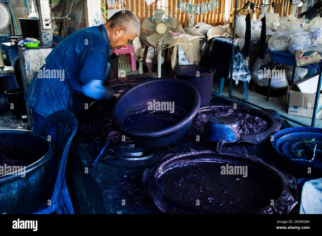 Thai craftsmanship technician or professional artist working batik ikat ...