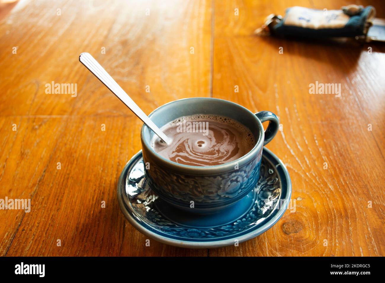 Hot ovaltine chocolate cocoa served in ceramic glass cup for travelers ...