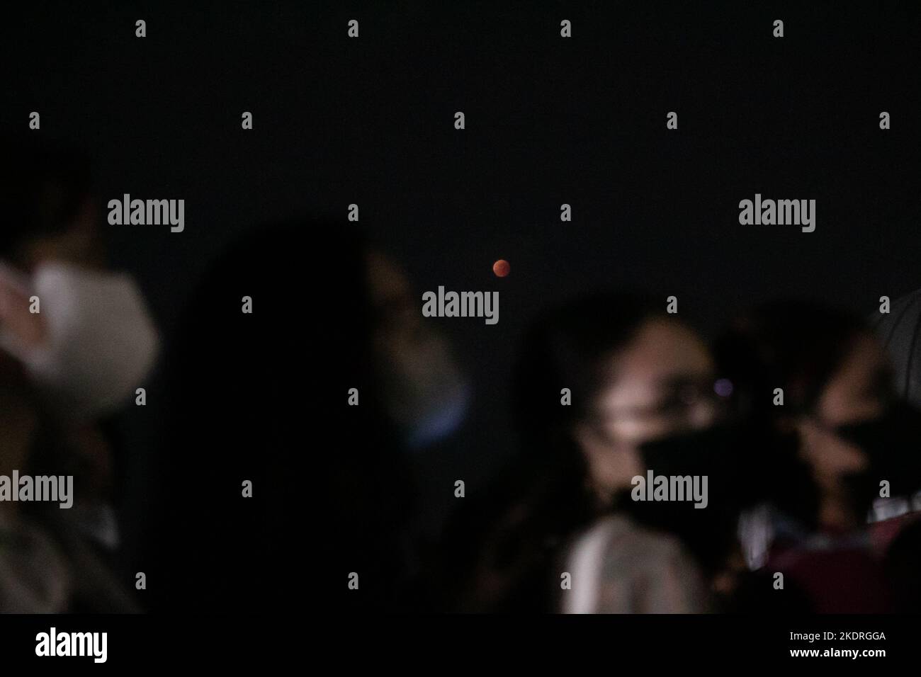 Manila, Philippines. 8th Nov, 2022. People queue to view a total lunar ...