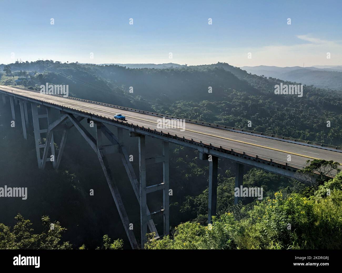 View of the bridge Puente de Bacunayagua with typical Cuban vintage car ...
