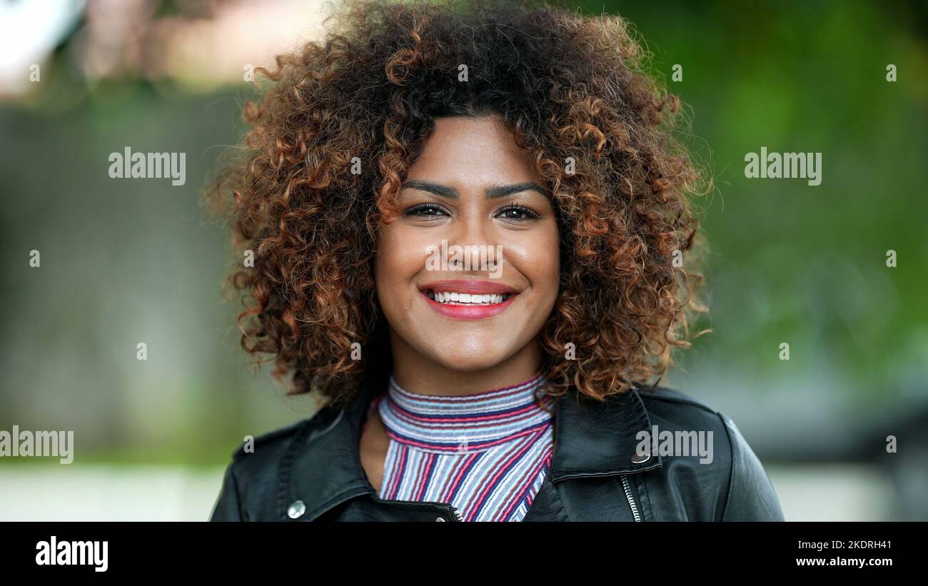 Happy Brazilian woman smiling at camera close-up face, diverse person ...
