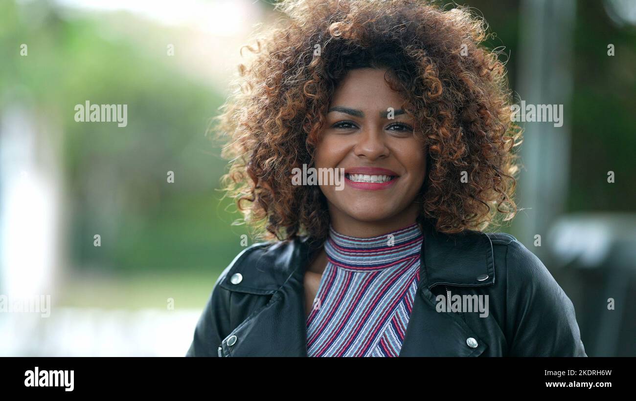 Happy Brazilian woman smiling portrait face Stock Photo - Alamy