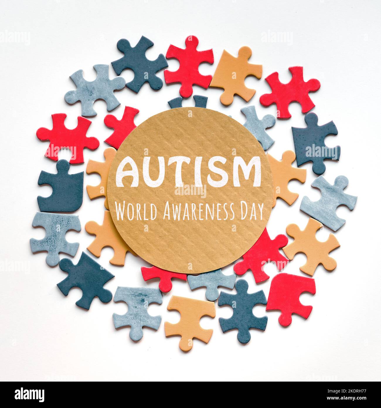 Autism World Awareness Day text on craft paper circle. Frame made with ...