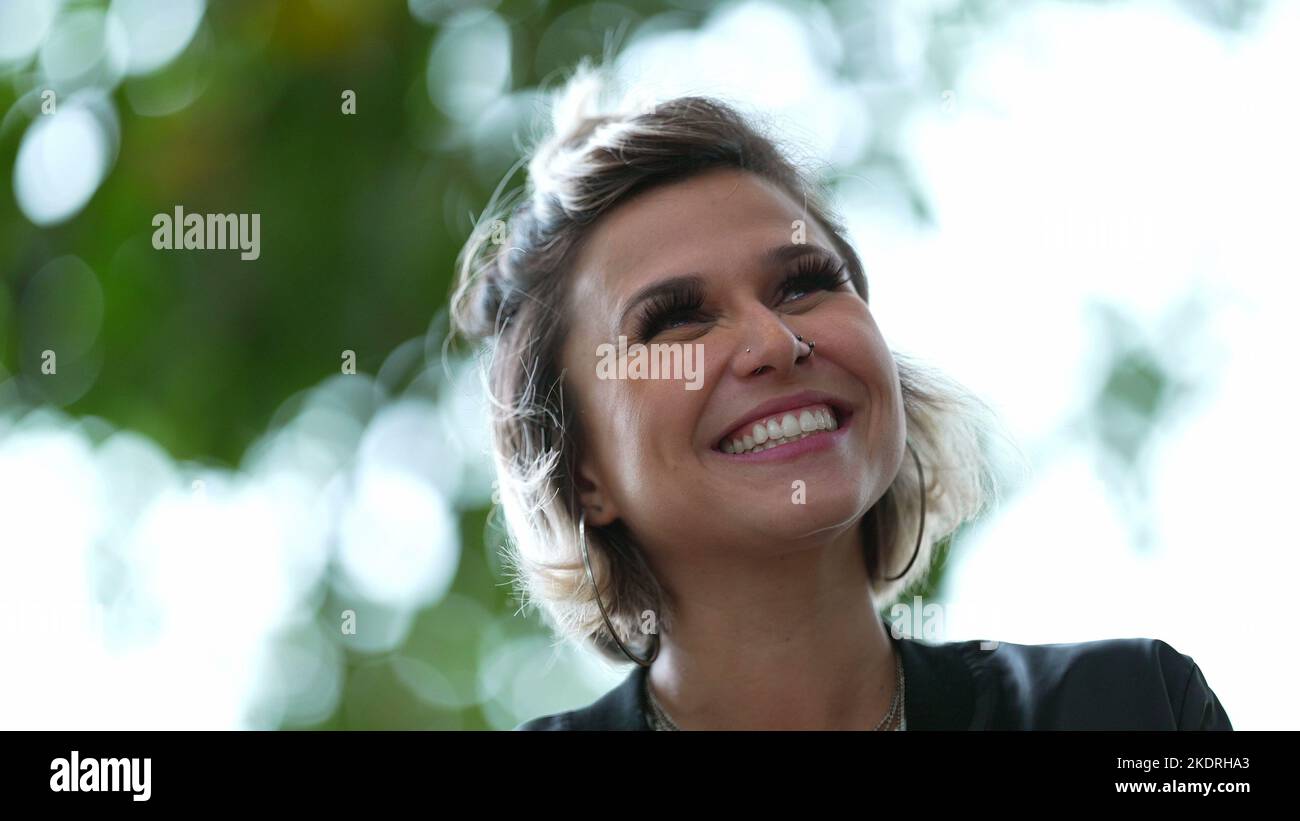 Happy woman spontaneous laugh and smile. Person real life authentic ...