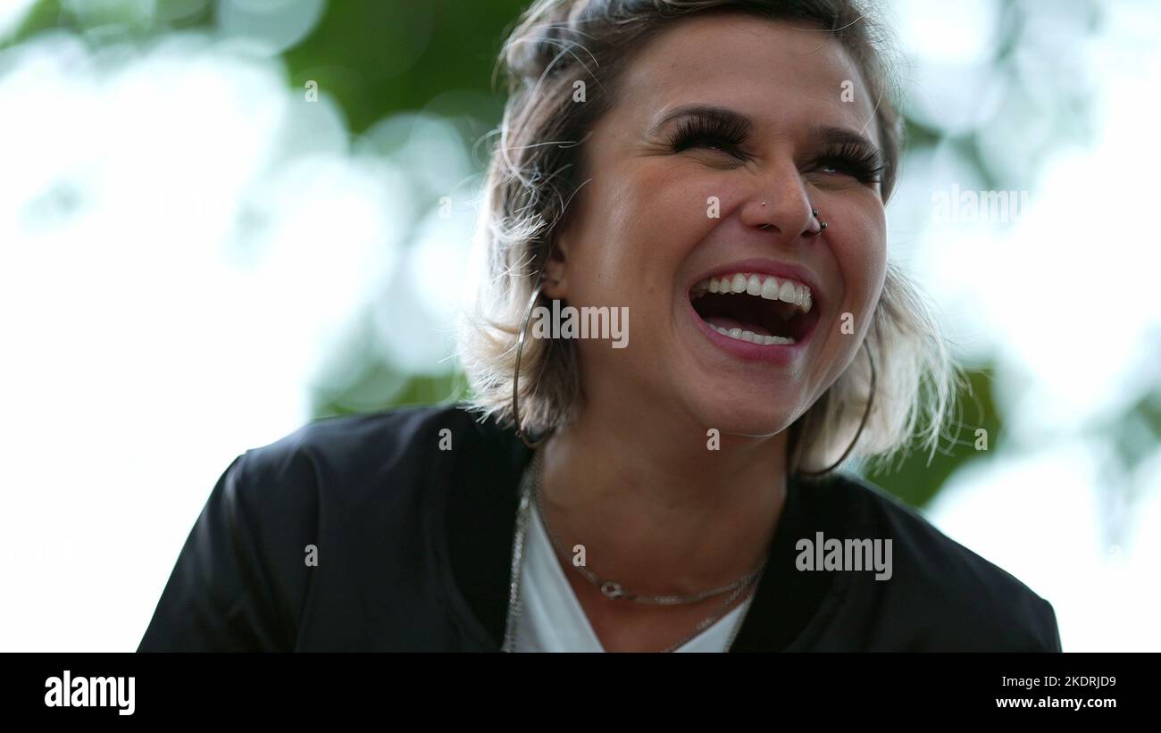 Happy woman spontaneous laugh and smile. Person real life authentic ...