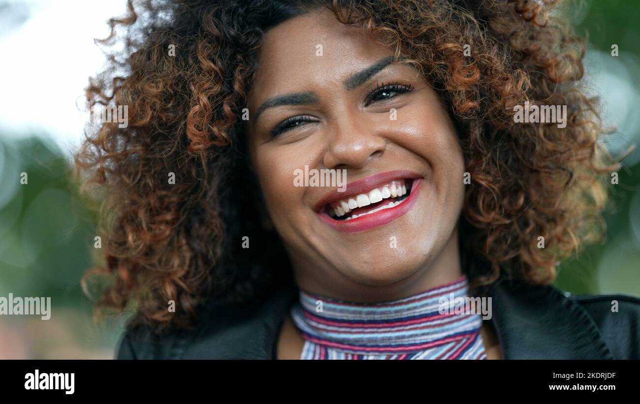 Joyful African woman smiling. Real life laugh and smile joyful emotion ...