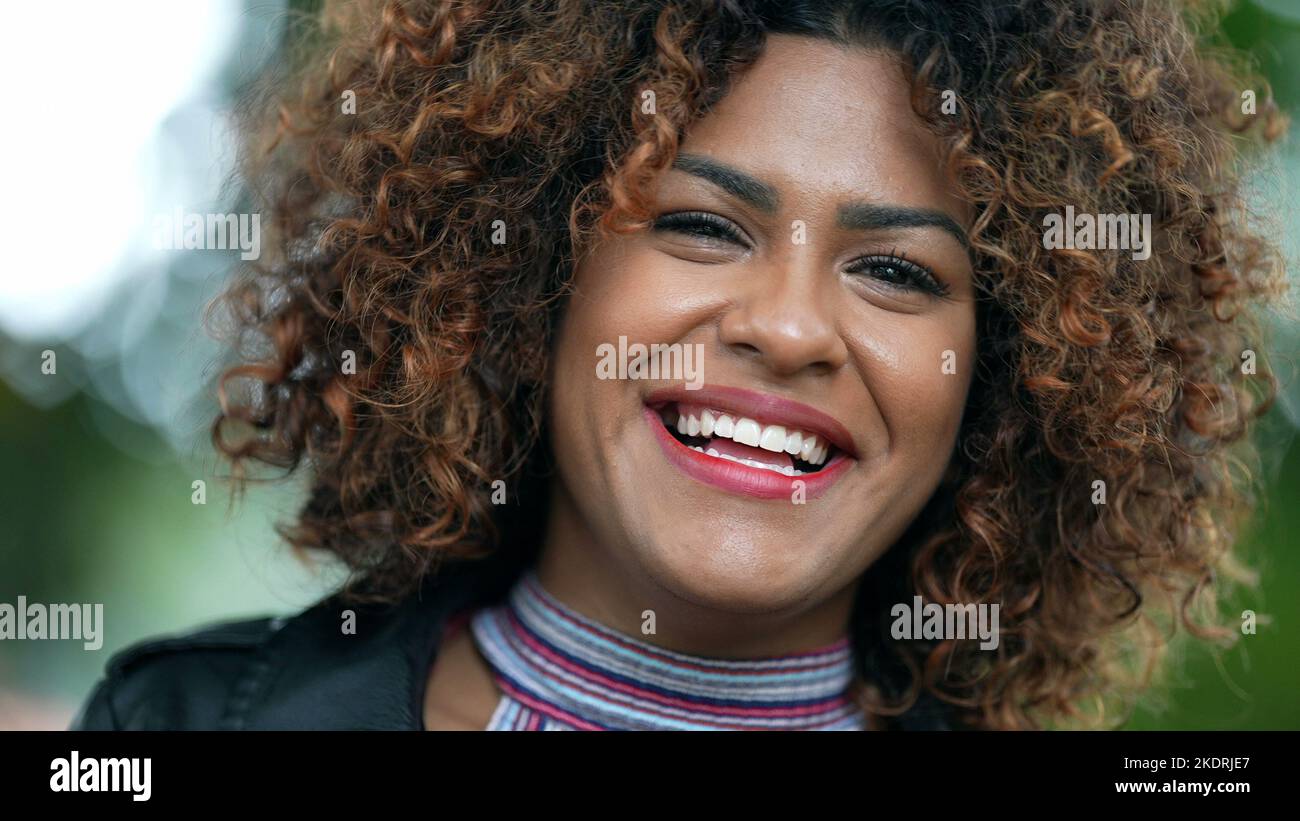 Joyful African woman smiling. Real life laugh and smile joyful emotion ...