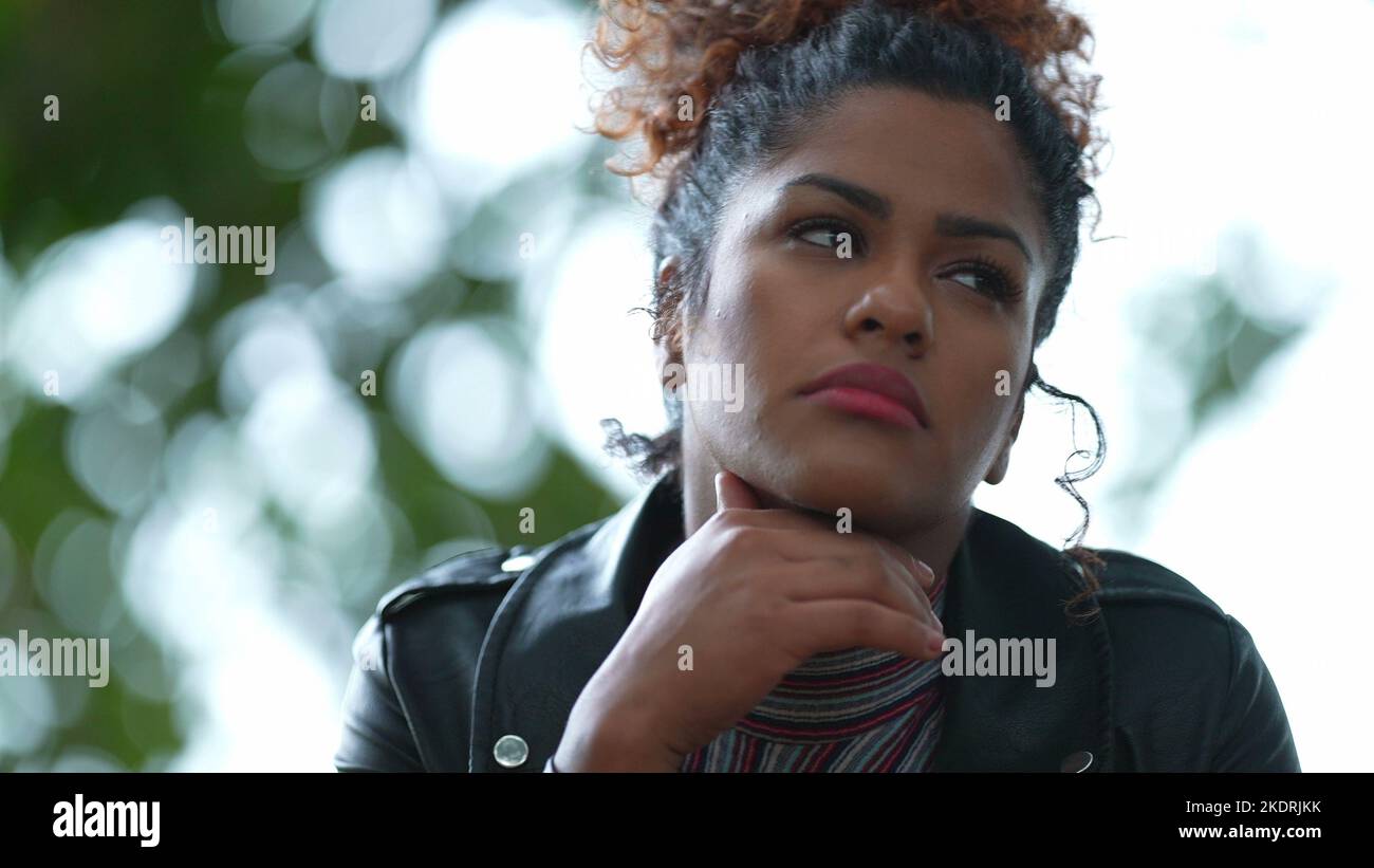 Pensive black woman thinking about life outside. Contemplative ...
