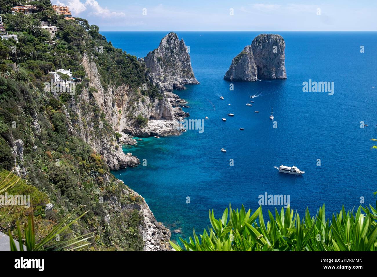 Photograph showing the cliffs on Island of Capri surrounded by crystal ...