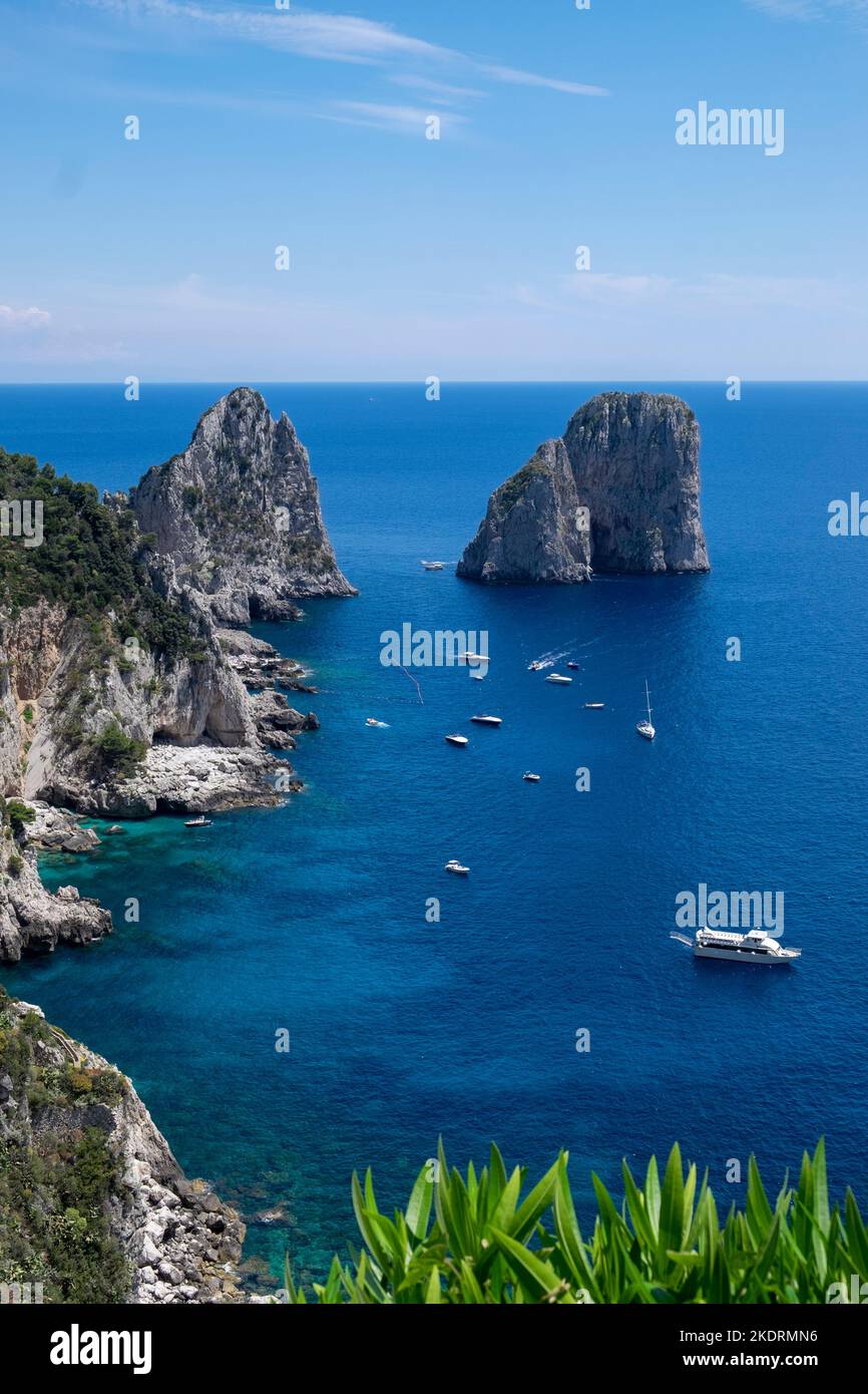 Photograph showing the cliffs on Island of Capri surrounded by crystal ...