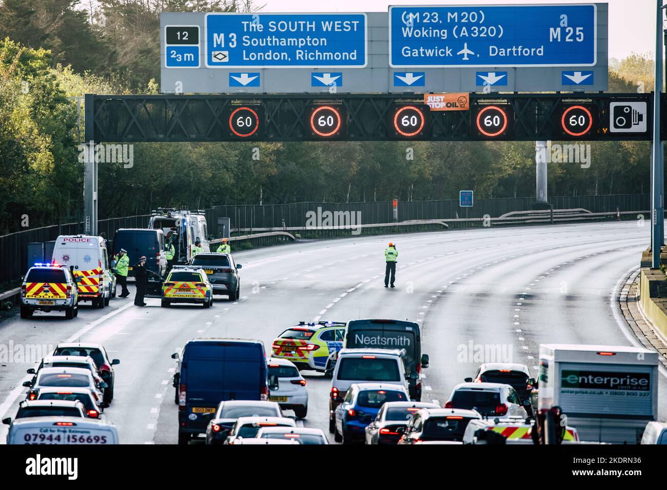 Thorpe, UK. 8th November, 2022. Surrey Police officers work to remove a ...