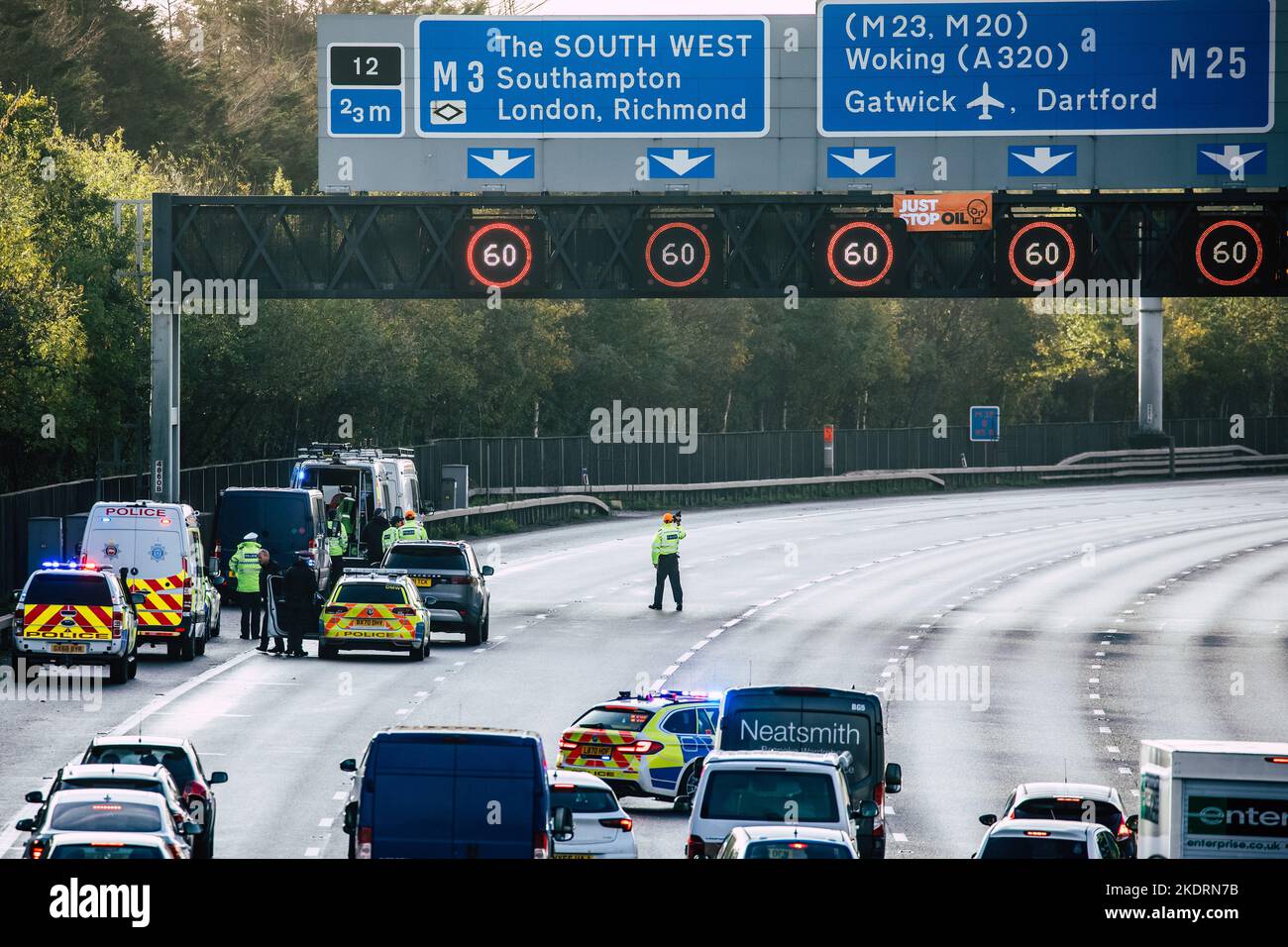 Thorpe, UK. 8th November, 2022. Surrey Police officers work to remove a ...