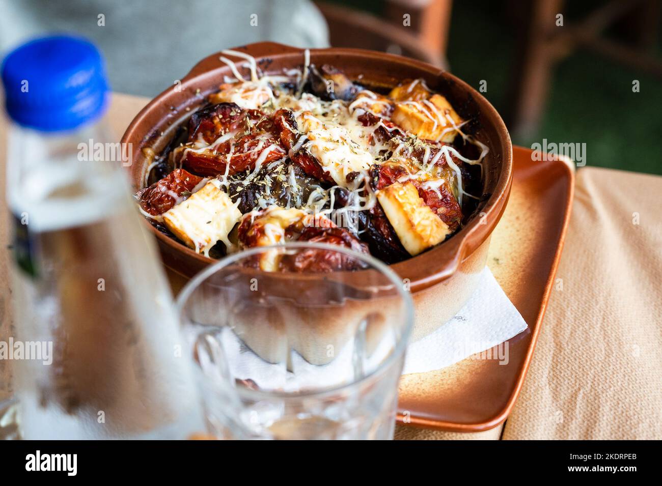 Family eating traditional Greek food in restaurant tavern in Greece ...