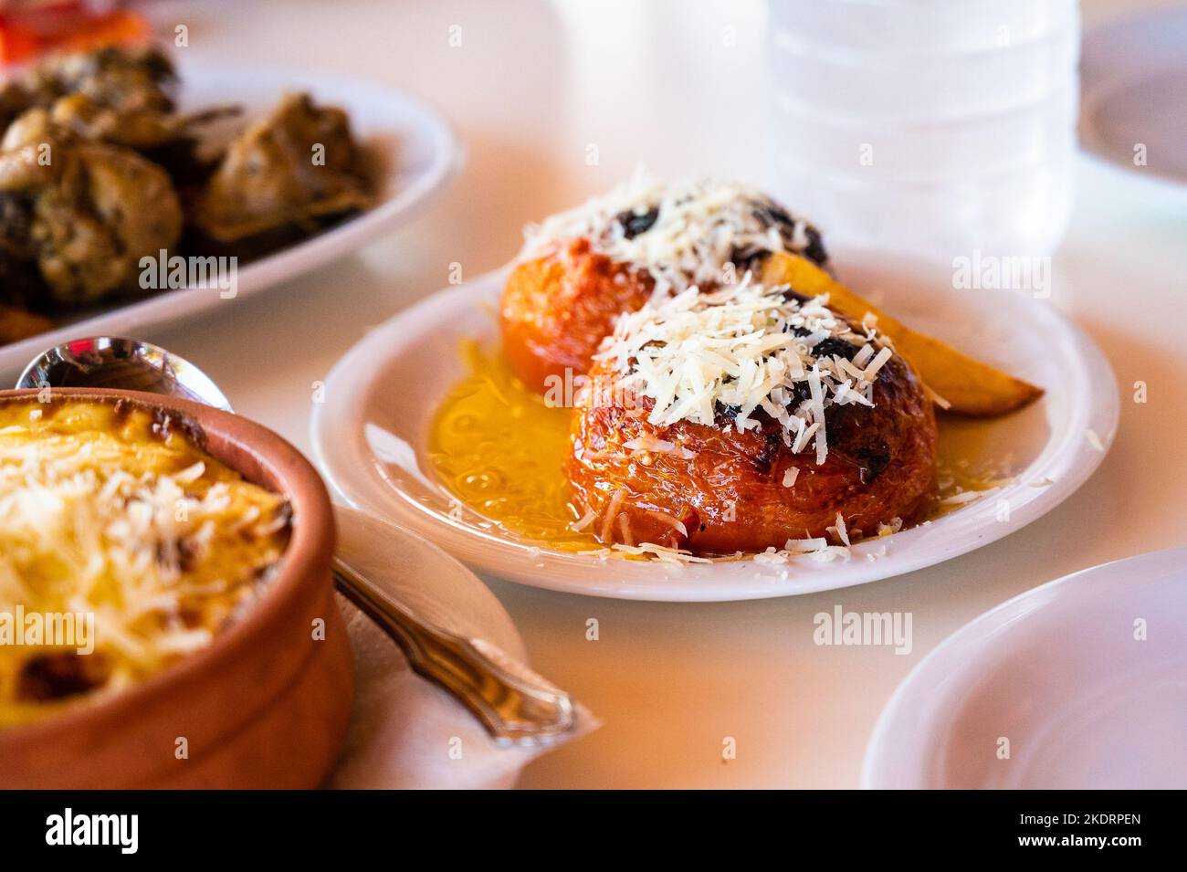 Family eating traditional Greek food in restaurant tavern in Greece ...