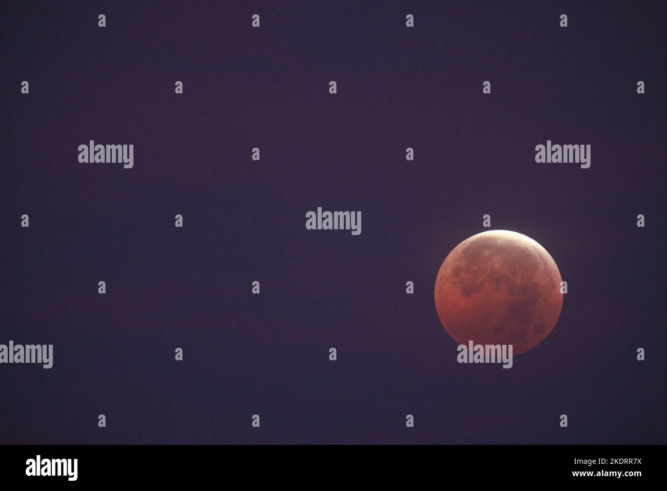 A total lunar eclipse seen in the western sky outside the polling place ...