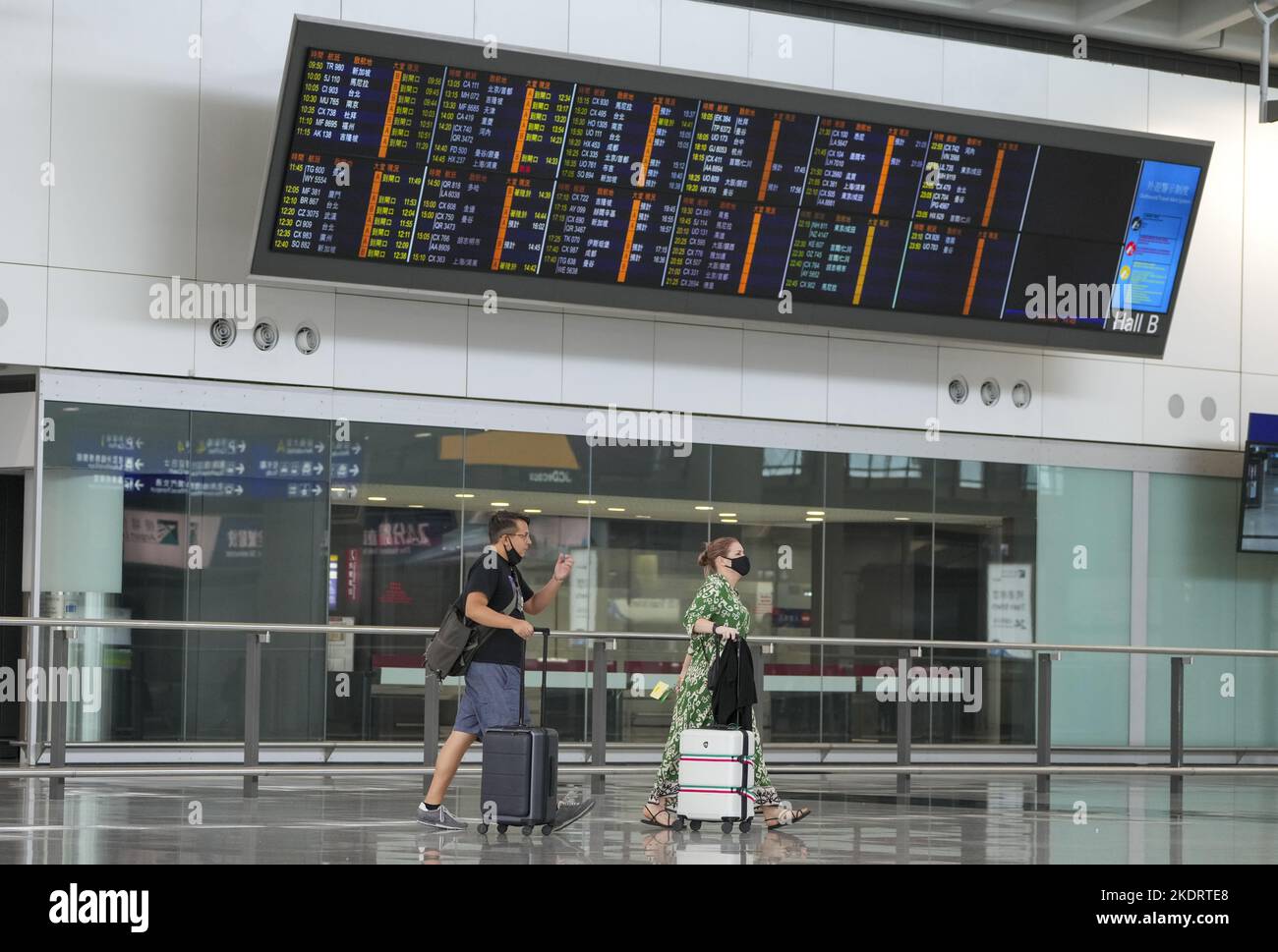 Passengers arrive at Hong Kong International Airport in Chek Lap Kok ...