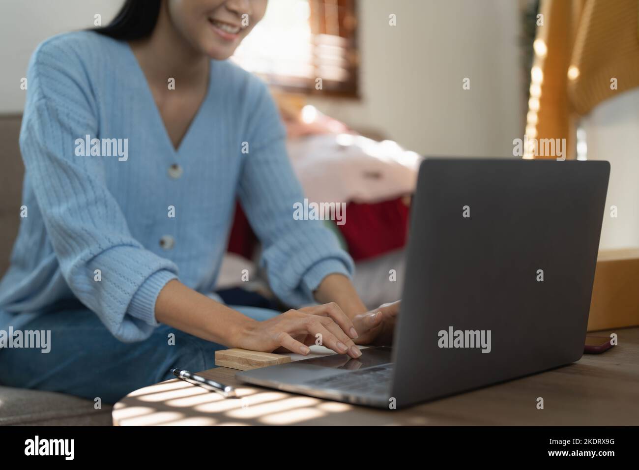 Young person using credit card and laptop computer. Online shopping, e ...