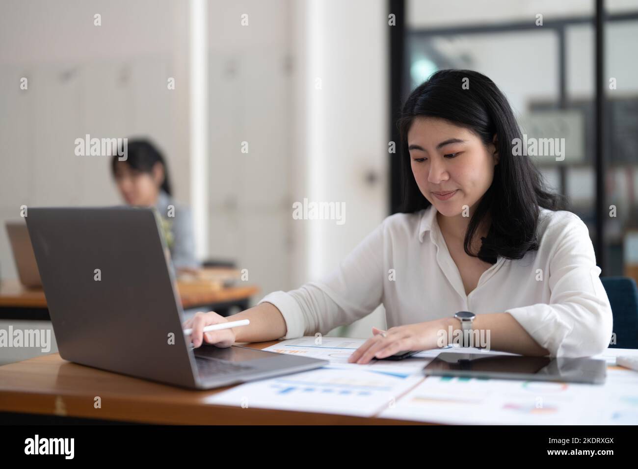 Portrait Of Attractive Asian Businesswoman Working On Laptop for ...