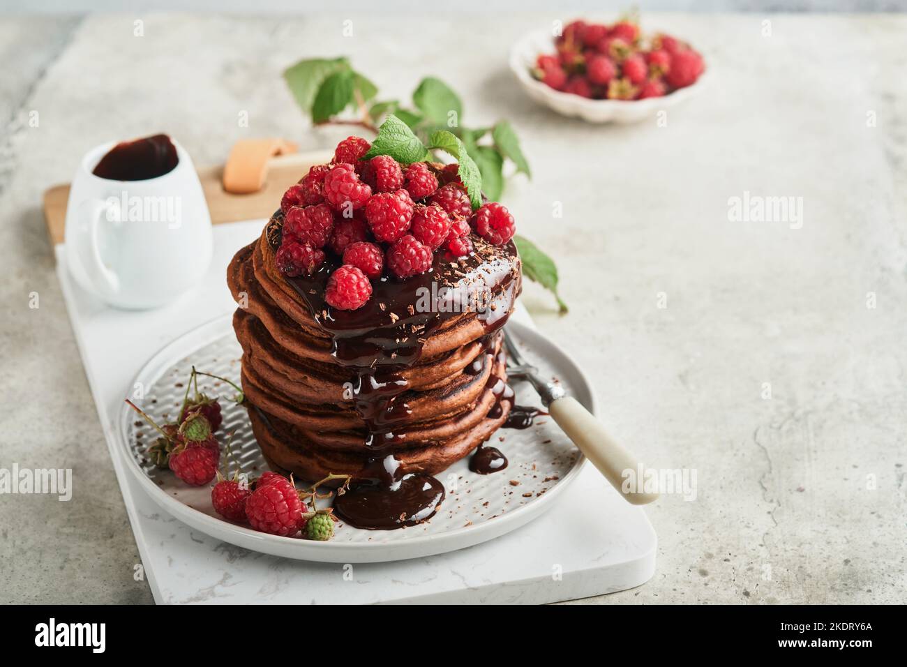 Chocolate Pancakes. Pancakes with fresh raspberry with chocolate glaze ...