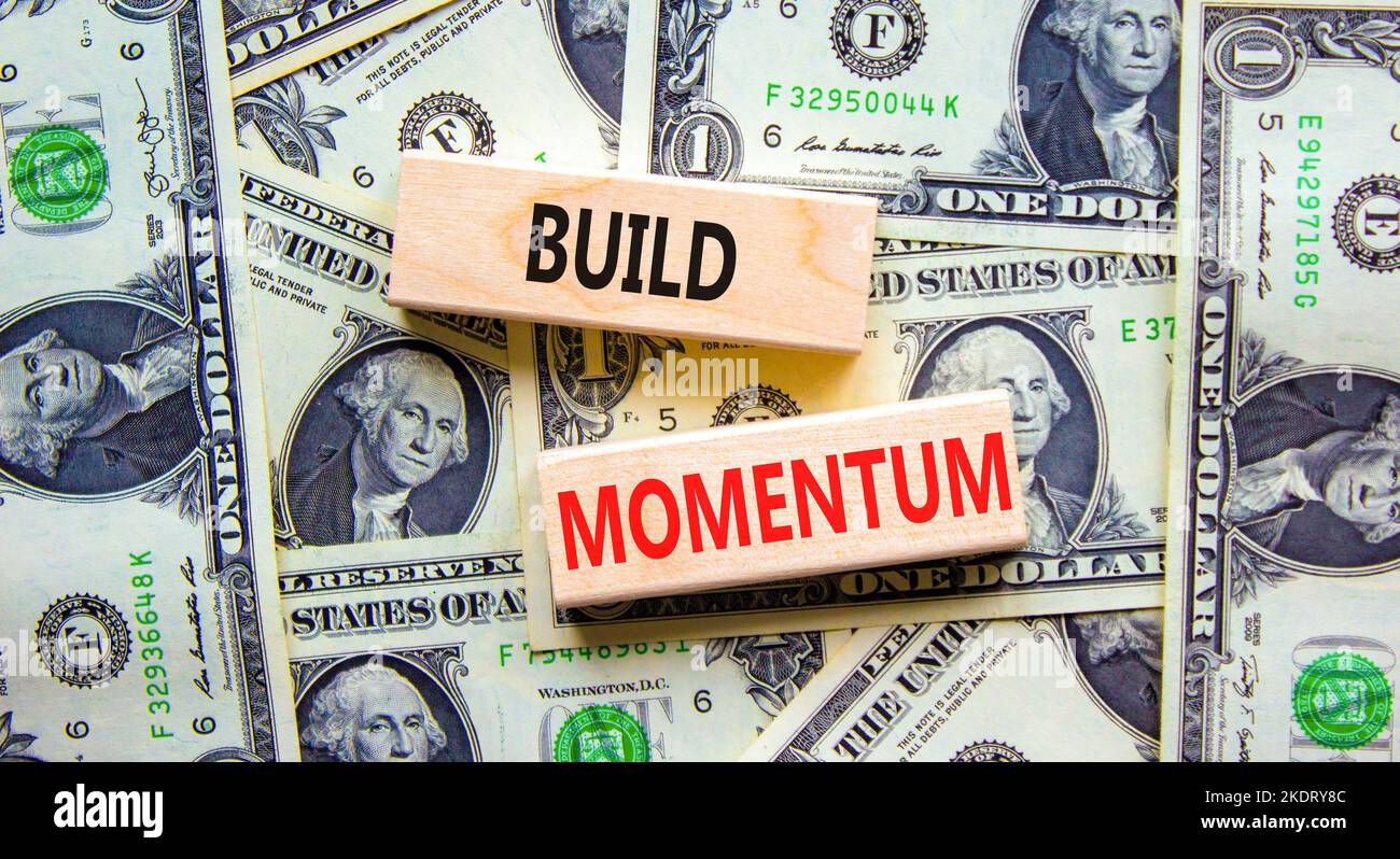 Build momentum symbol. Concept words Build momentum on wooden blocks ...