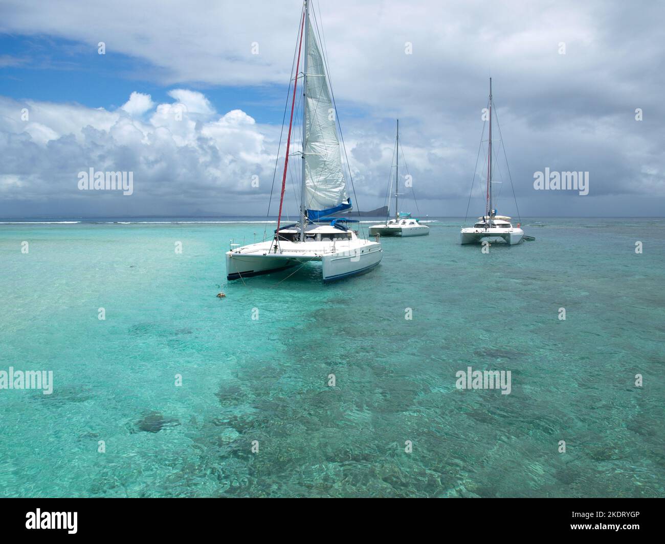 Catamaran in front of a cloudy sky near the island of Mauritius Stock ...