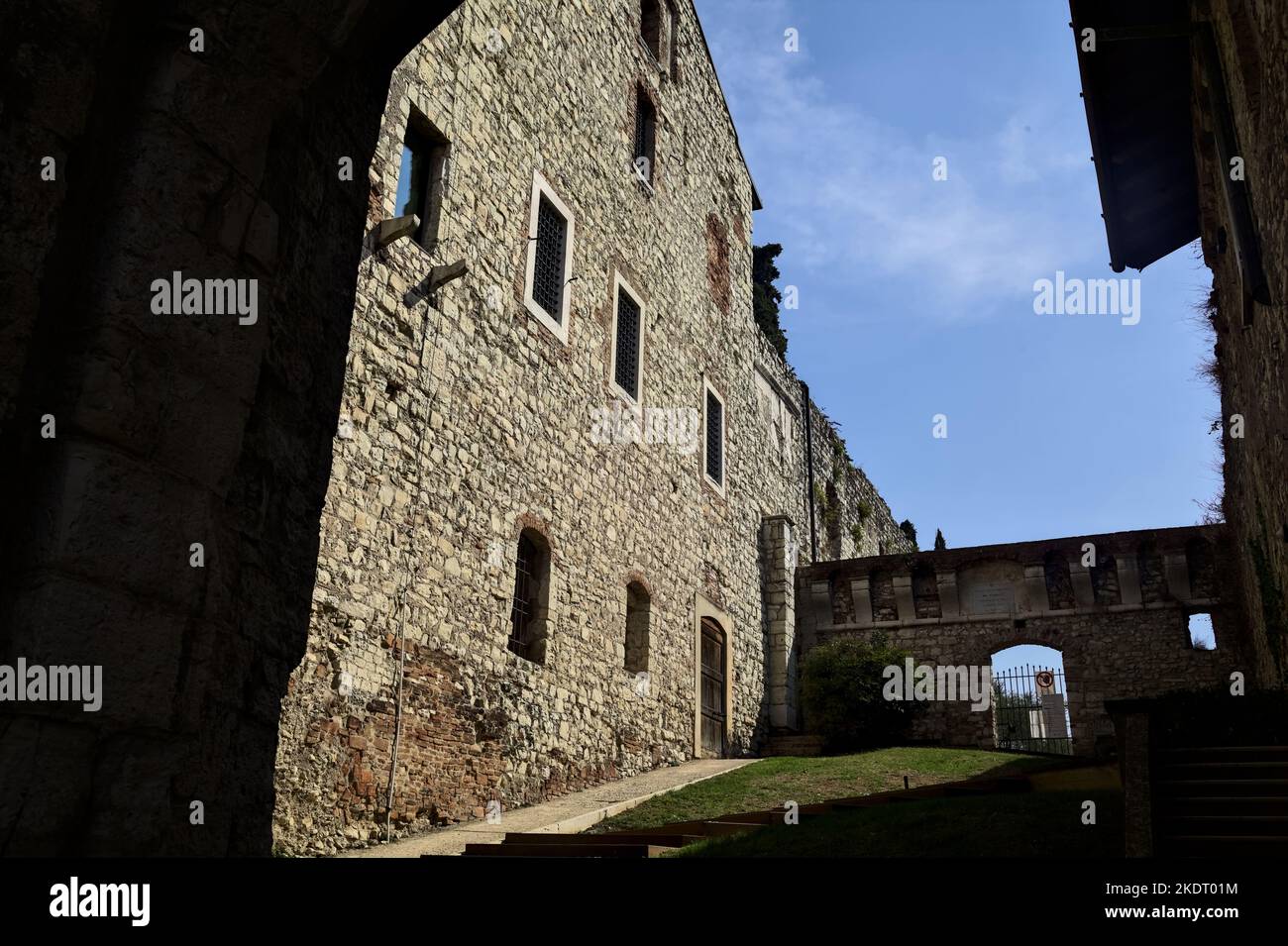 Inner yard partly in the shade with a staircase in a castle Stock Photo ...