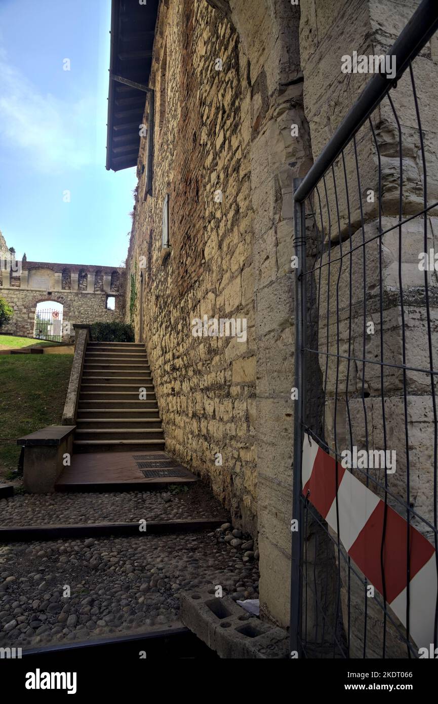 Inner yard partly in the shade with a staircase in a castle Stock Photo ...