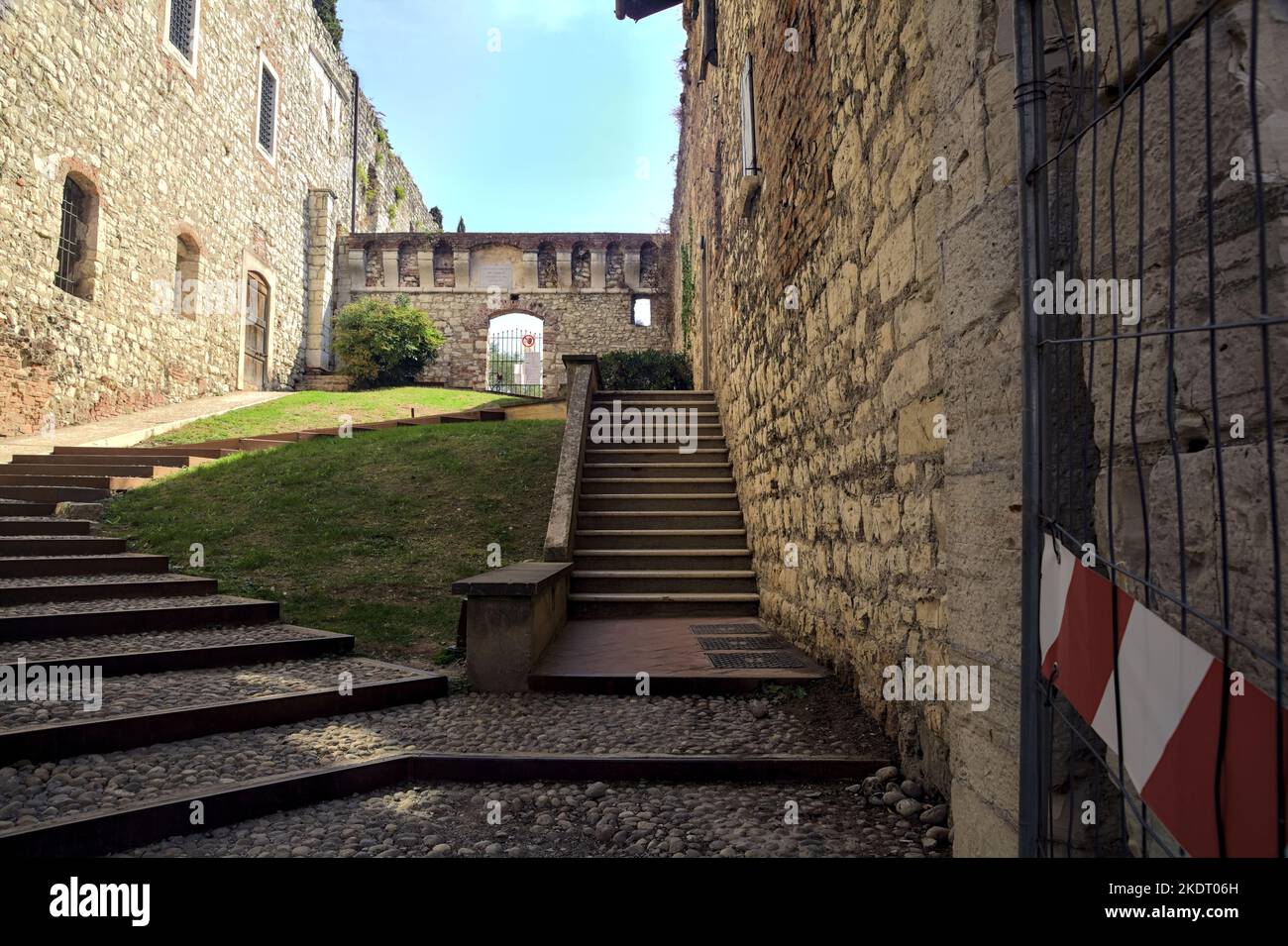 Inner yard partly in the shade with a staircase in a castle Stock Photo ...