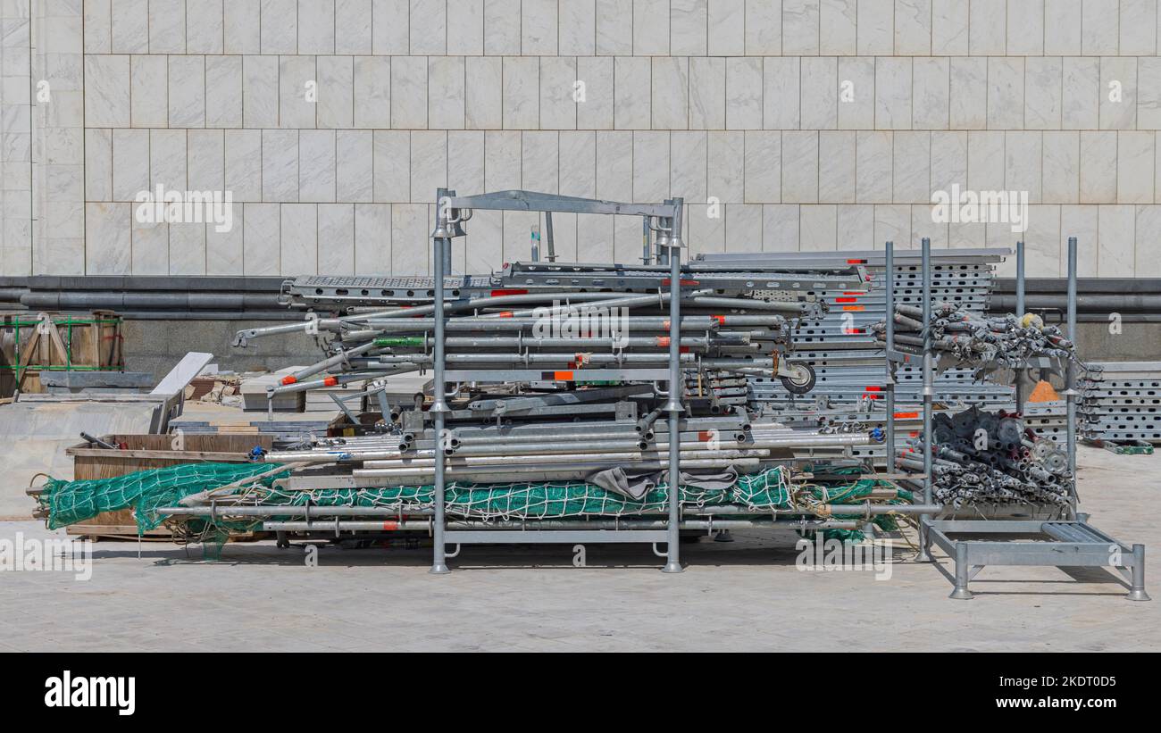 Packed Scaffolding Set in Front of Construction Site Stock Photo - Alamy