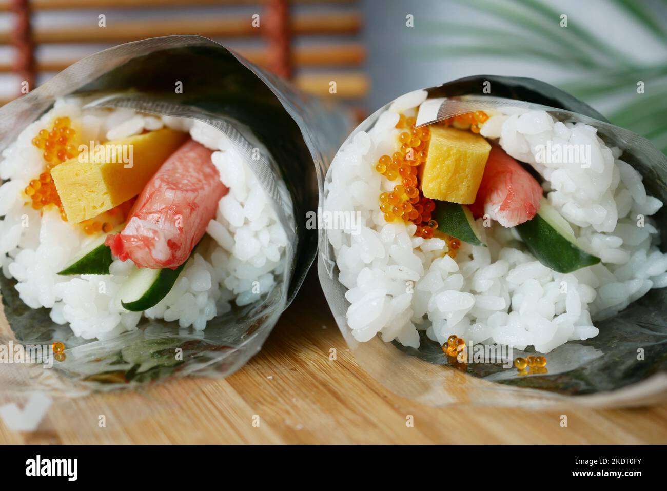 Sushi roll with salmon, shrimps and rice roll on table Stock Photo - Alamy