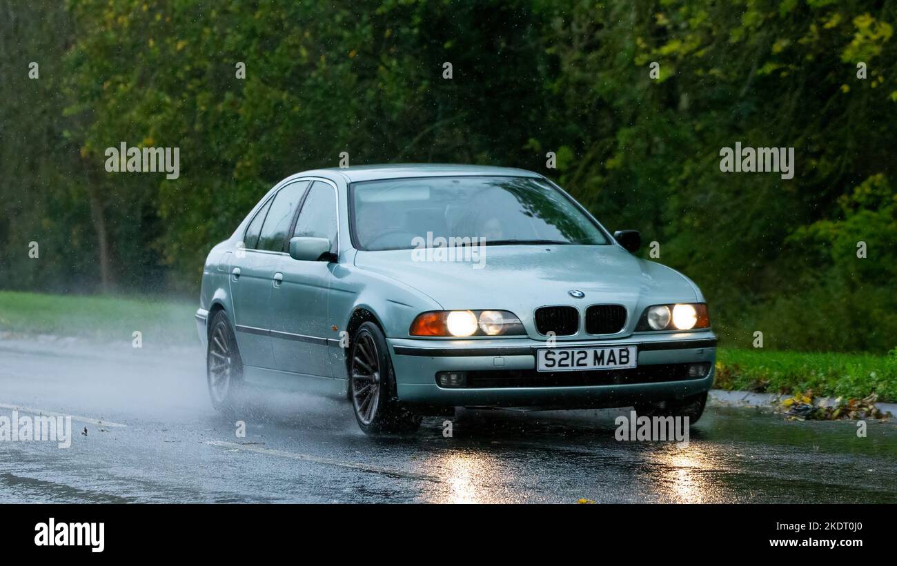 1998 BMW 523 classic car driving in the rain on a wet road Stock Photo ...