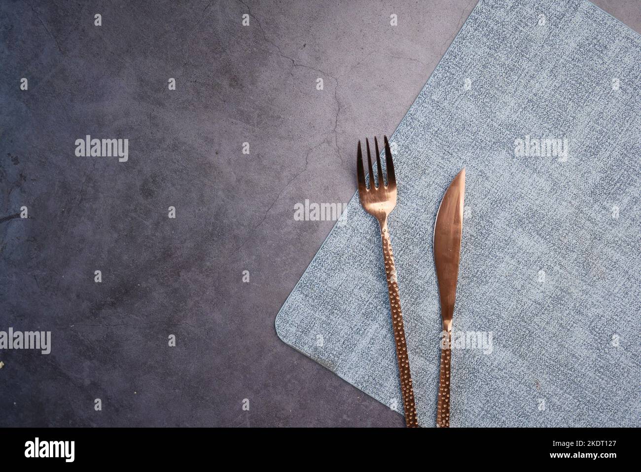 Top view of cutlery on black background Stock Photo - Alamy
