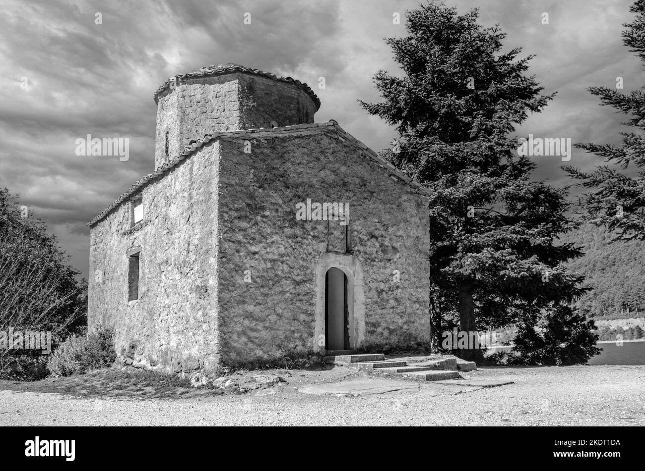 Small stone chapel of St. Fanourios on lake Doxal in Ancient Feneos of ...