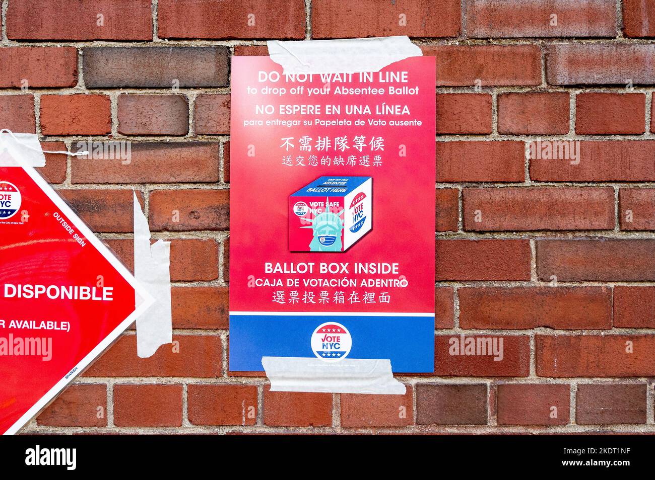 A sign saying "Do not wait in line to drop off your absentee ballot ...
