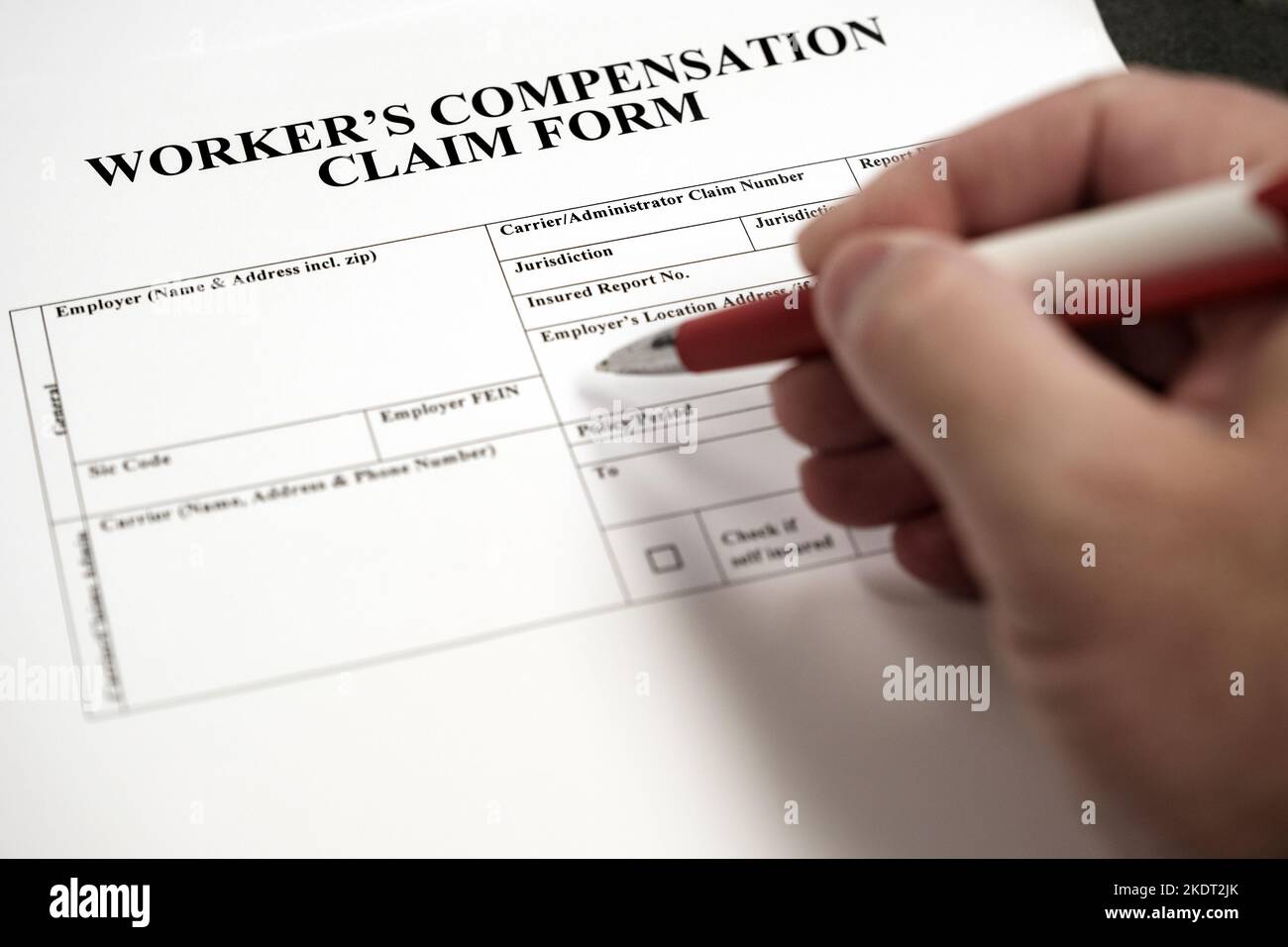 Workers Compensation Complaint Form Hand signing document Stock Photo ...