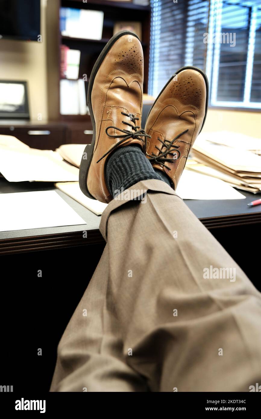 Business man businessman with feet up on desk relaxing Stock Photo - Alamy