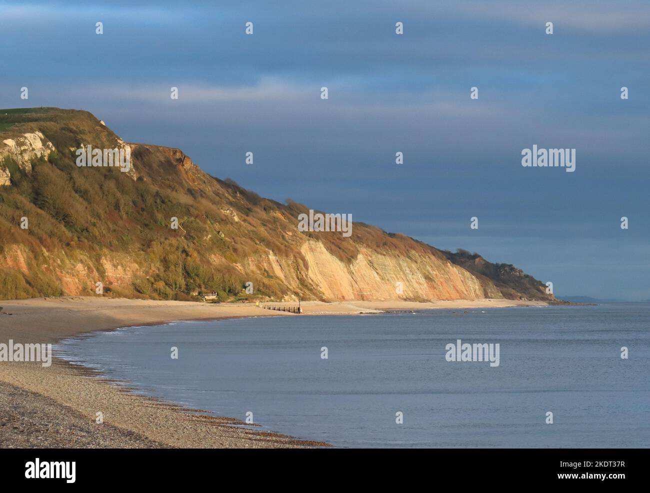 Evening sun on the rocks of the Jurassic coast at Axmouth in Lyme Bay ...