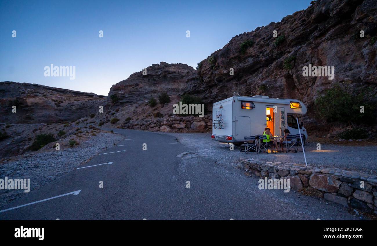 Motorhome RV parked on beach under a cliff, Crete, Greece. Family ...