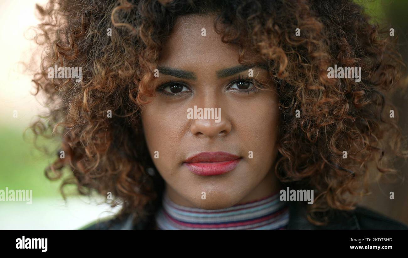 Serious African woman portrait close-up face looking at camera Stock ...