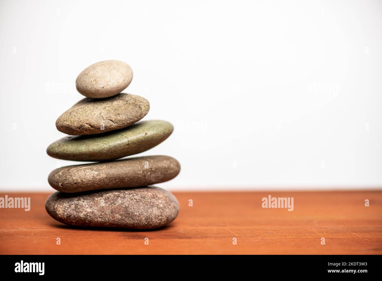 stacked stones against a white background with copy space Stock Photo ...